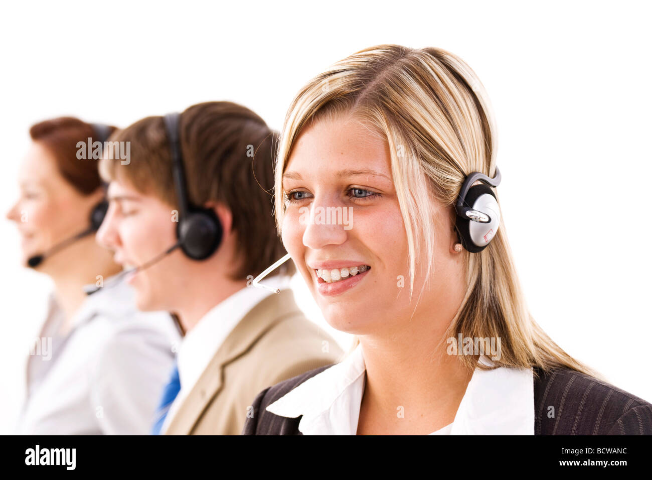 Three people with headsets Stock Photo - Alamy
