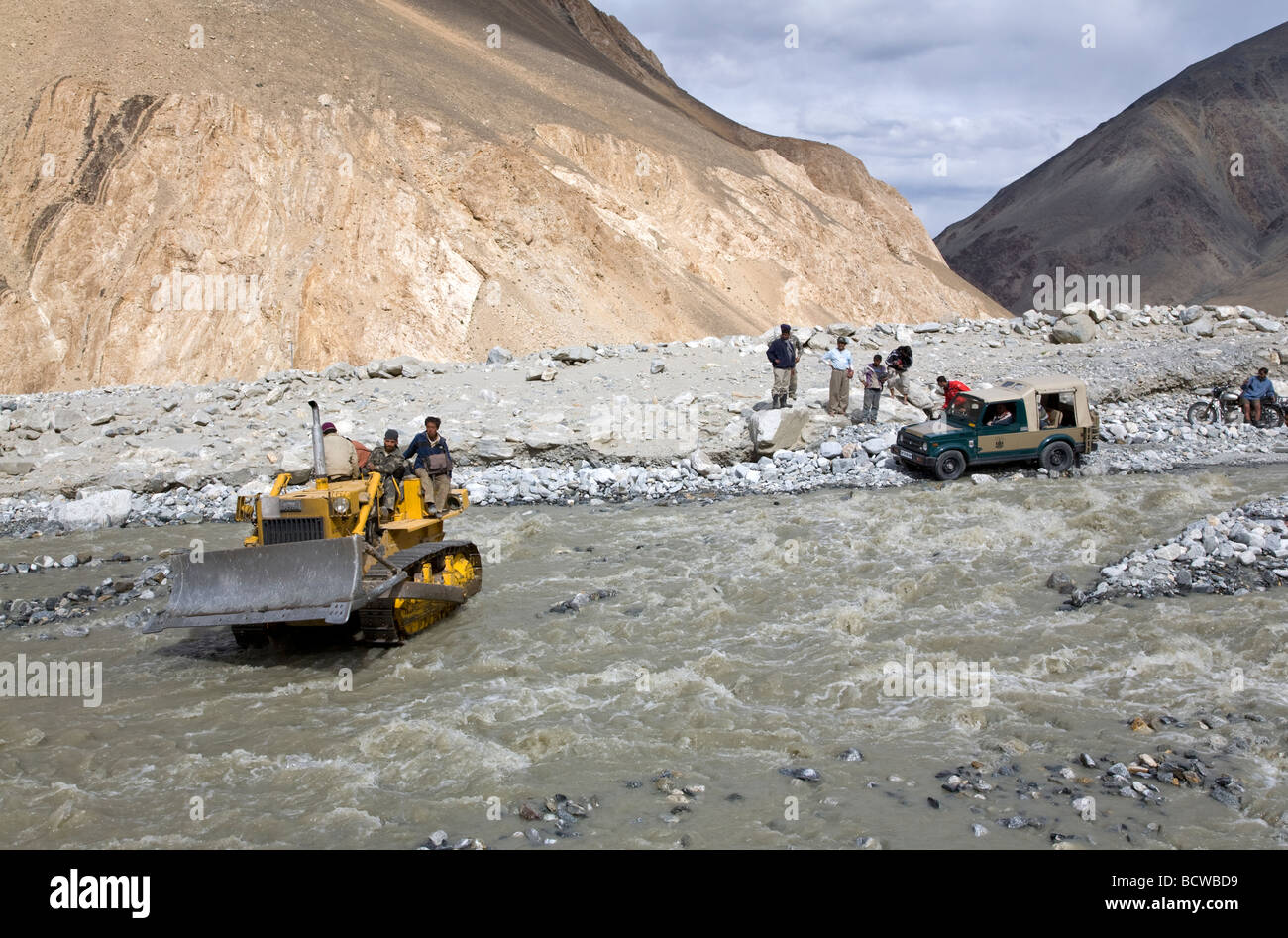 People crossing a river by caterpillar. Near Pangong Lake. Ladakh ...