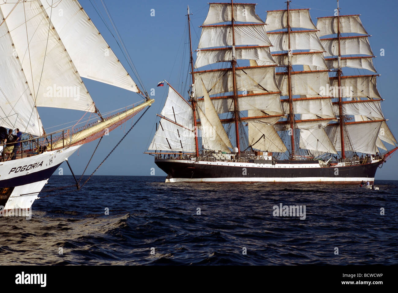 The bow of Pogoria barquentine ship from Poland with Russian Sedov ship ...