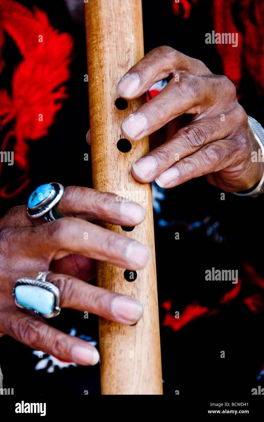 Mid section view of a person playing a flute Stock Photo - Alamy
