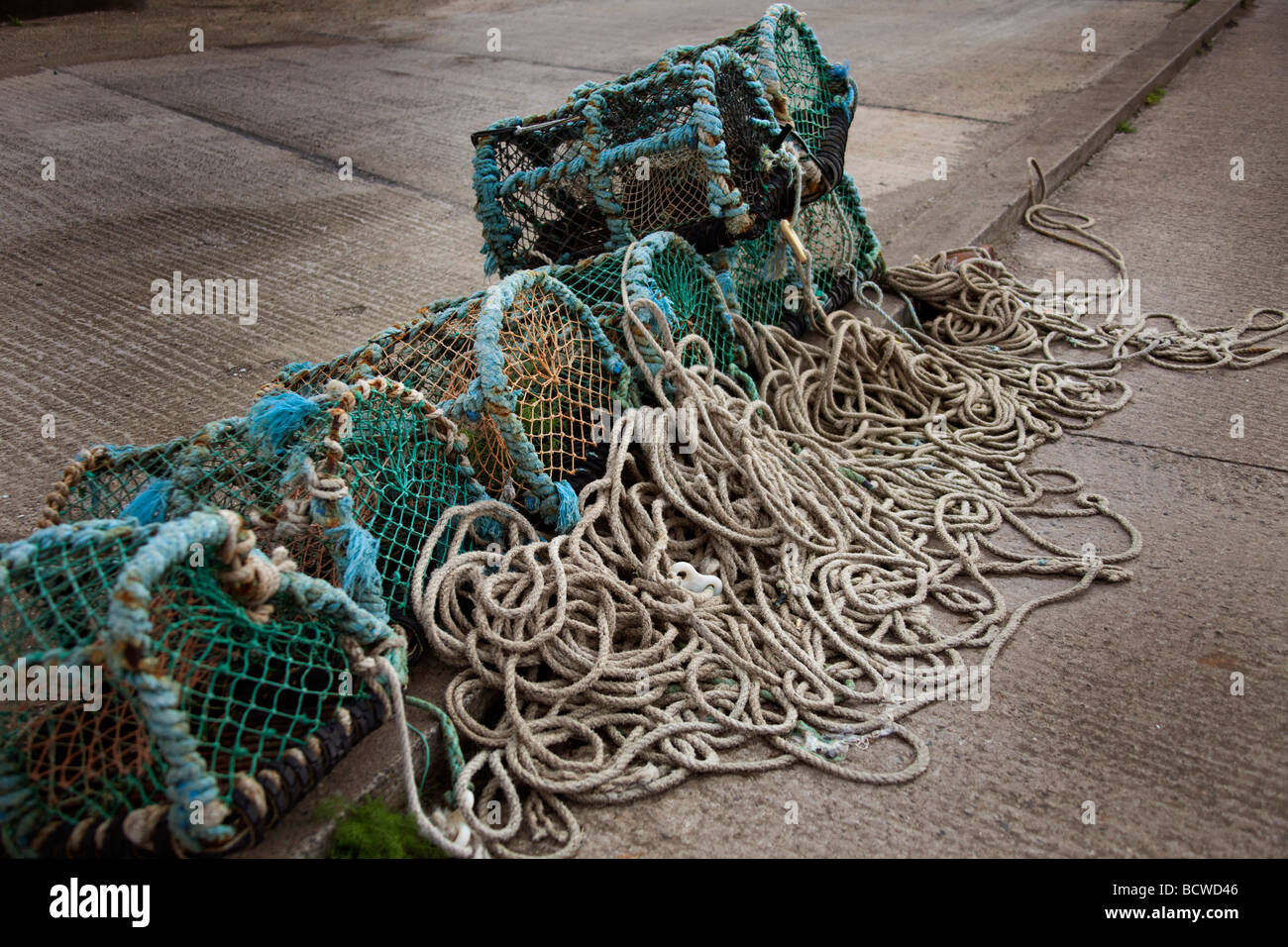 Lobster pots with ropes on quay side. Lindisfarne Northumberland 96973 ...