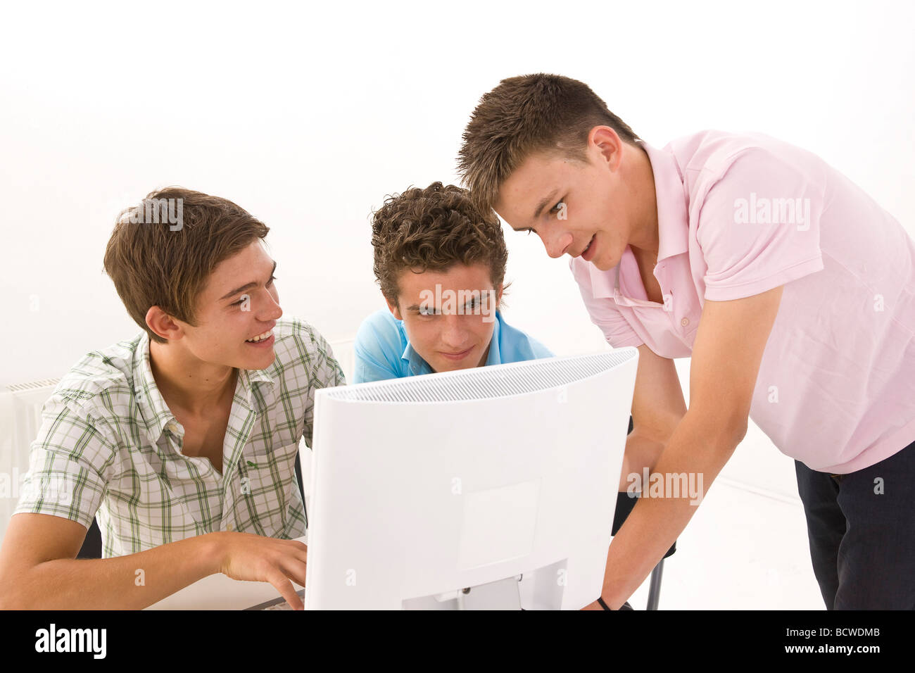 Three boys doing homework together Stock Photo - Alamy