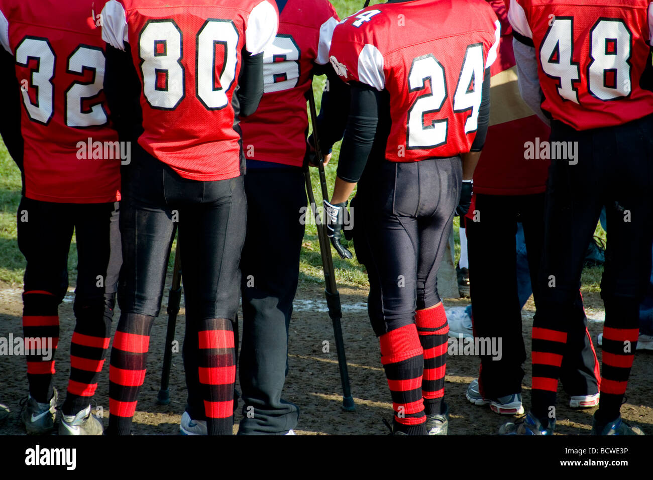 Rear view of football players standing together Stock Photo - Alamy