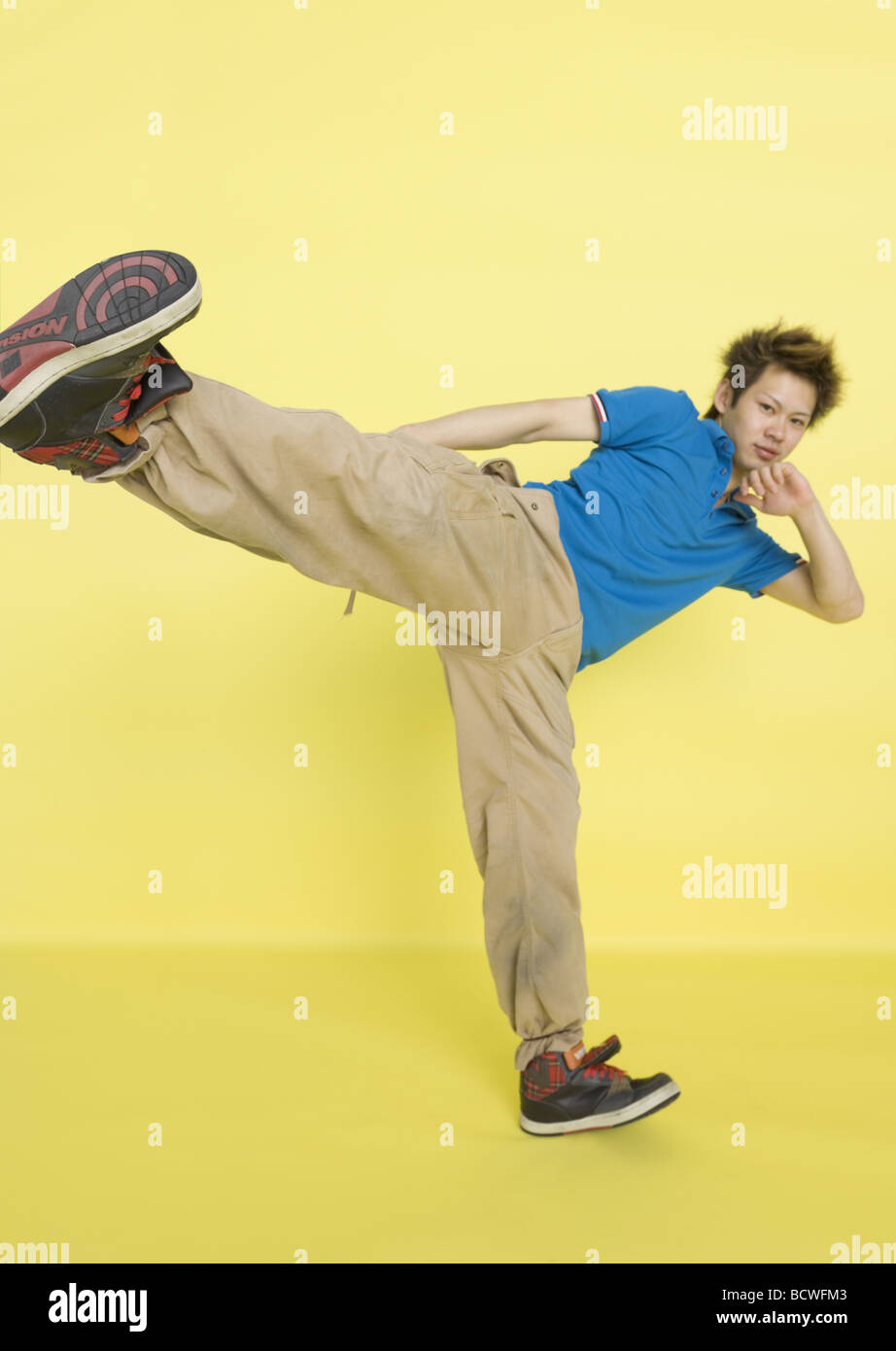 Kicking pose hi-res stock photography and images - Alamy