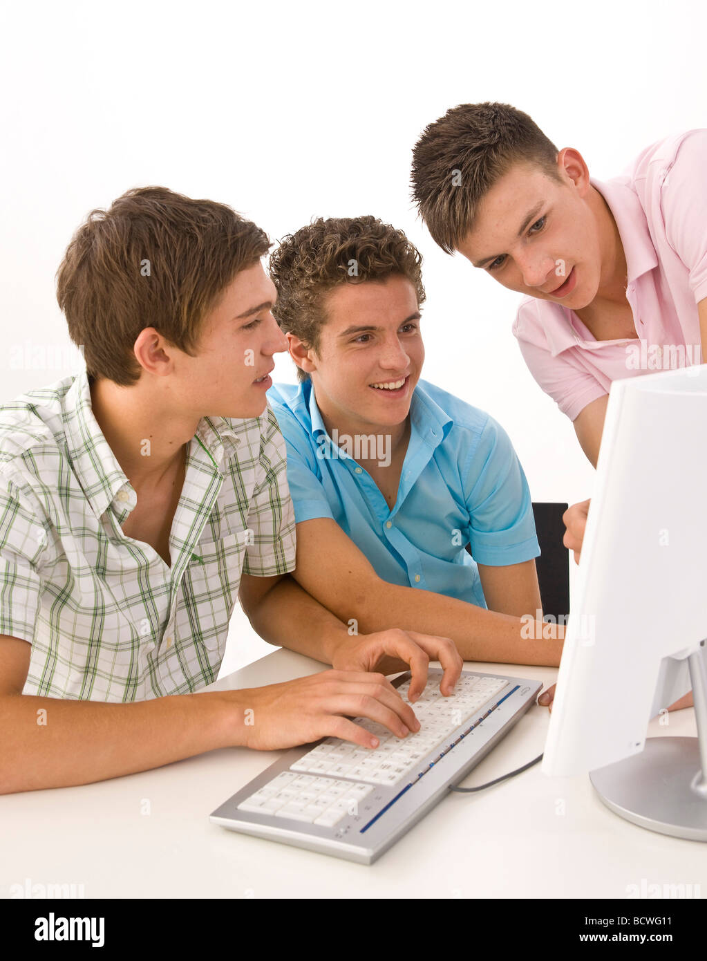 Three boys doing homework together Stock Photo - Alamy