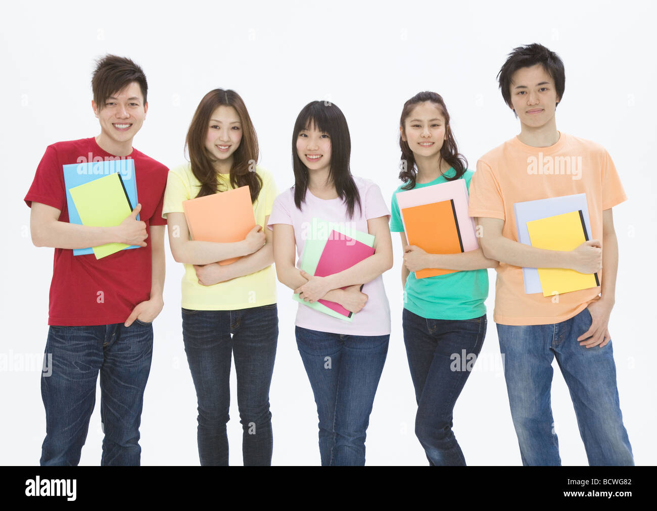 Young men and women holding notes Stock Photo - Alamy