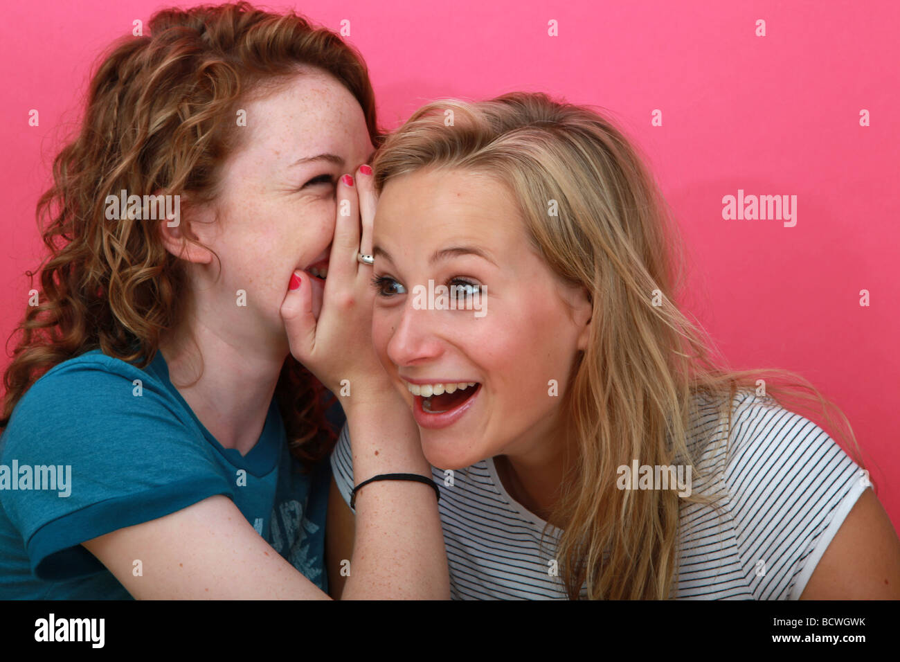 teenage girls whispering Stock Photo - Alamy