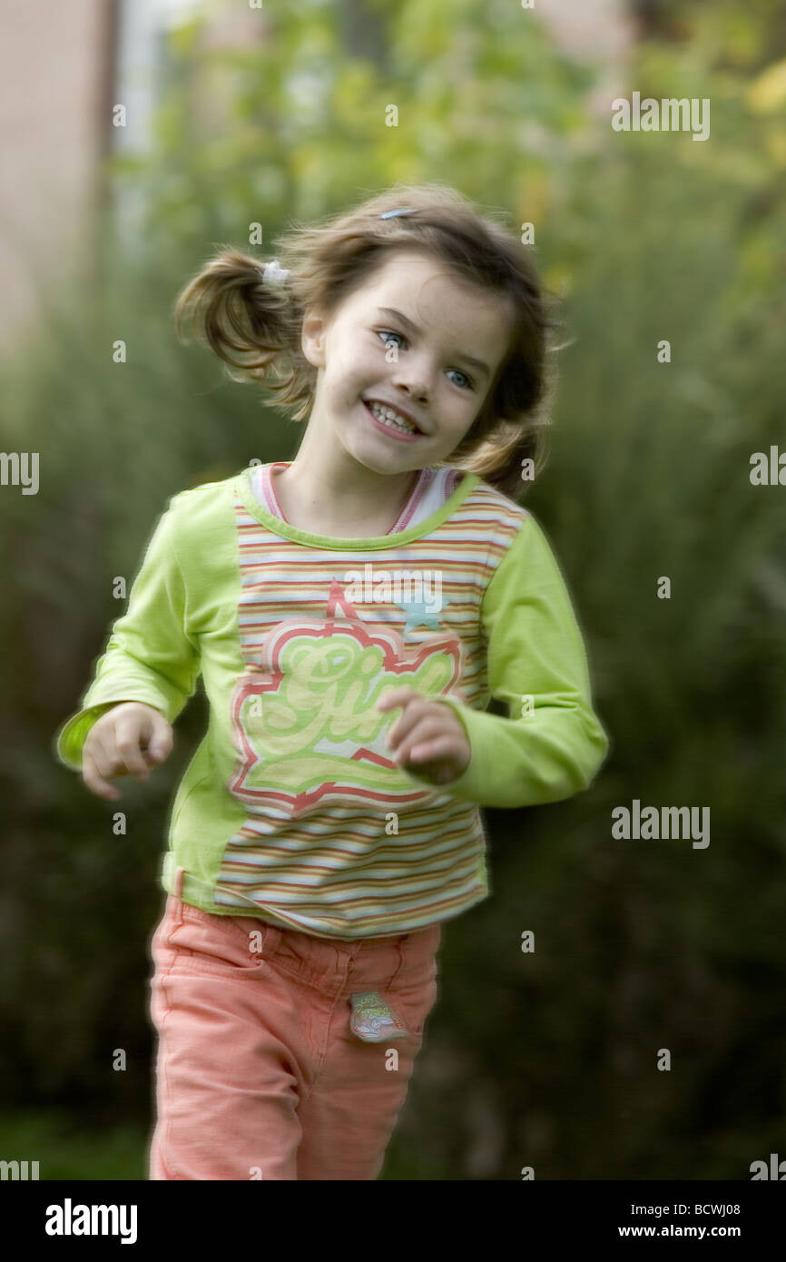 Adorable child running to camera , physical exercise Stock Photo - Alamy