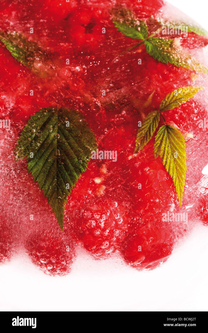 Raspberries frozen, in a block of ice Stock Photo - Alamy