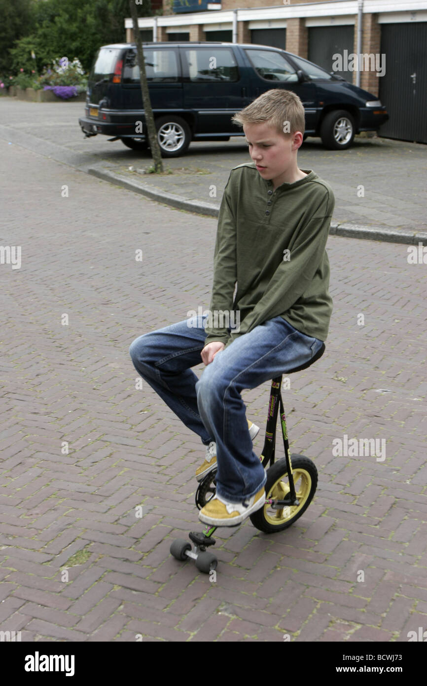 Boy Riding Unicycle High Resolution Stock Photography and Images - Alamy