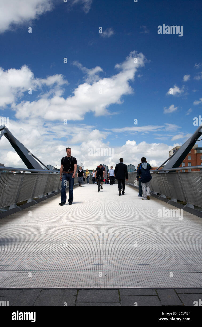 People walking across bridge hi-res stock photography and images - Alamy