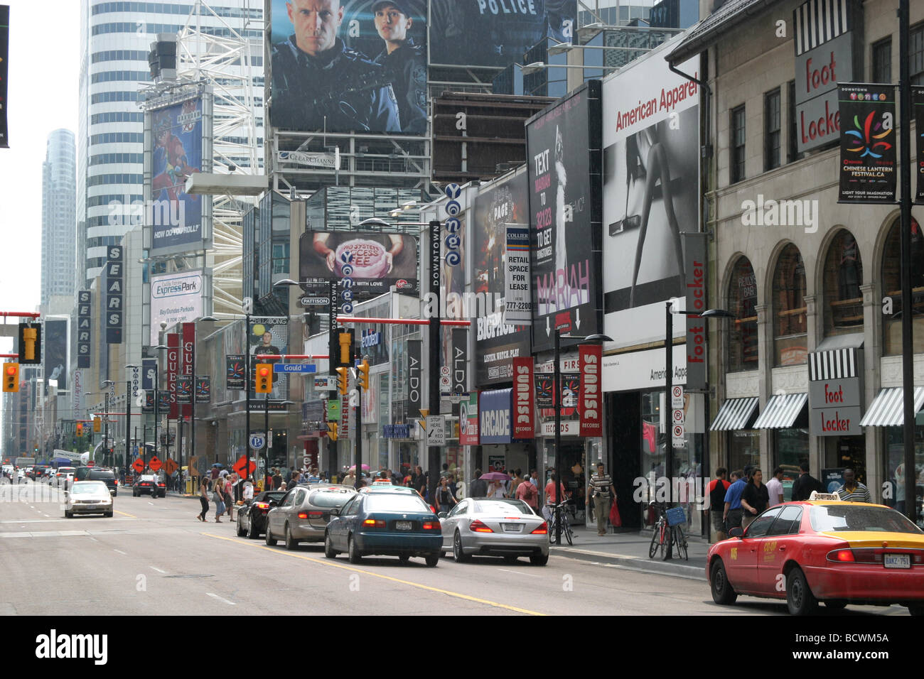 downtown city retail shop facades and street traffic Stock Photo - Alamy