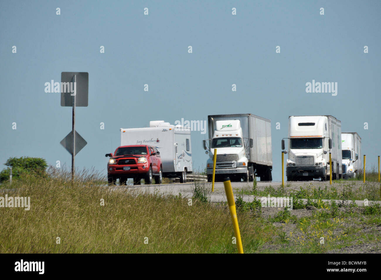 Interstate traffic with trucks Stock Photo - Alamy