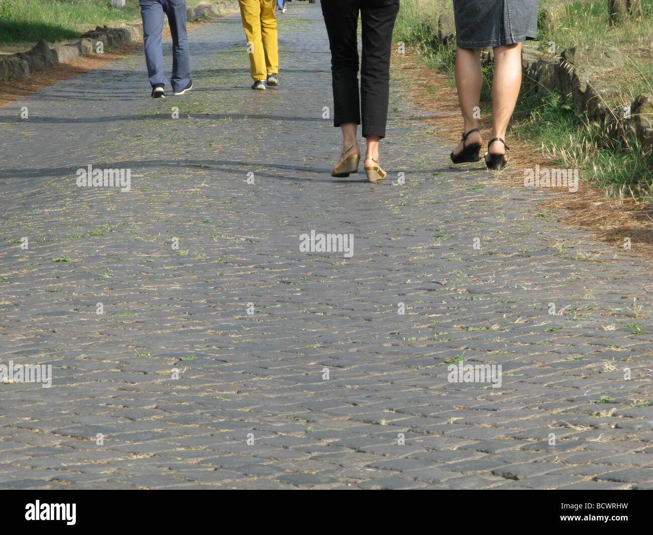 people walking on the ancient roman old appian way, rome, italy Stock ...
