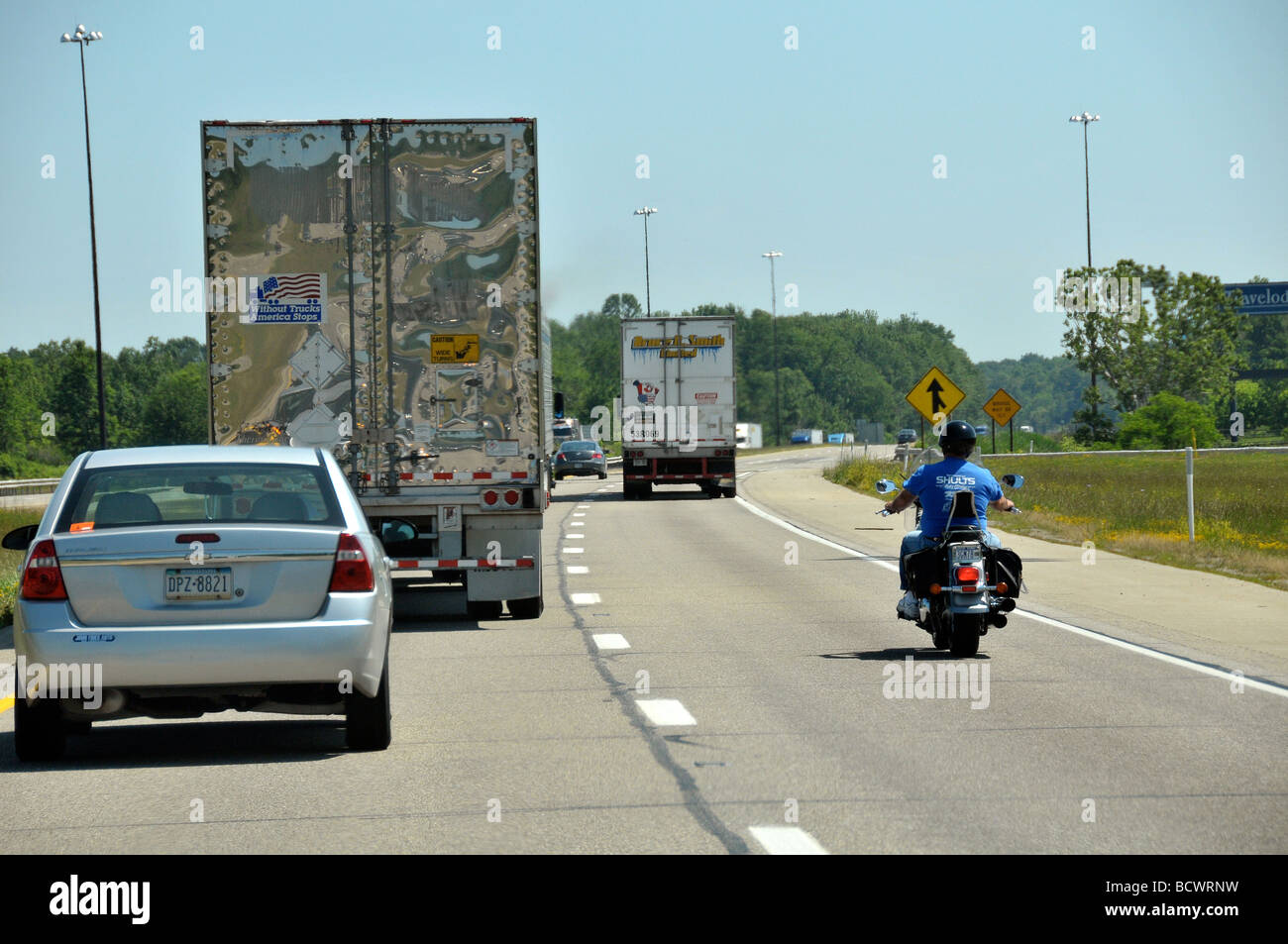 Interstate traffic with trucks Stock Photo - Alamy