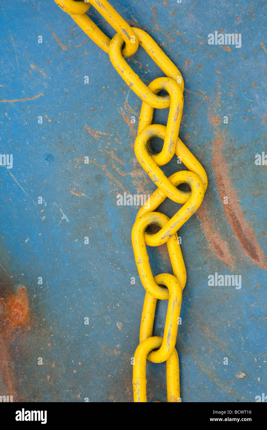 Yellow chain and blue steel on a fishing boat Stock Photo - Alamy