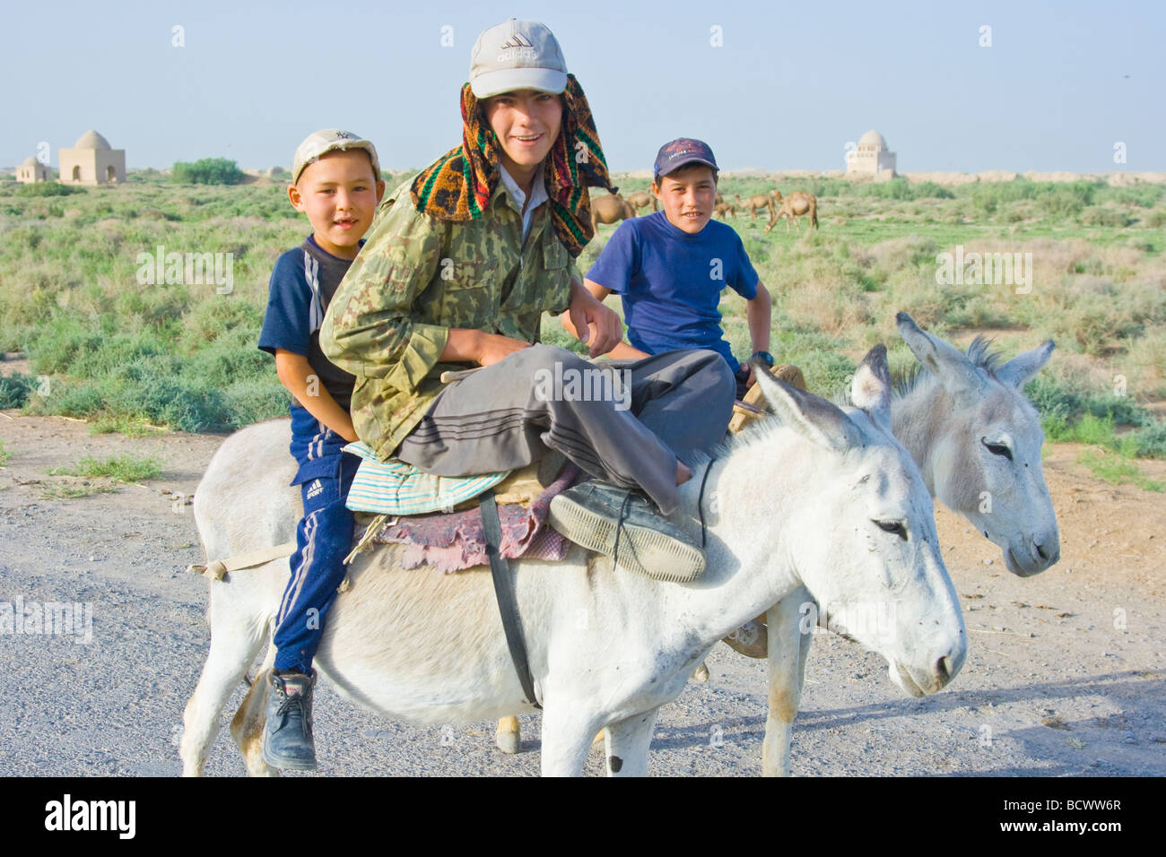 Boys Riding Donkeys at the Ruins of Merv in Turkmenistan Stock Photo ...