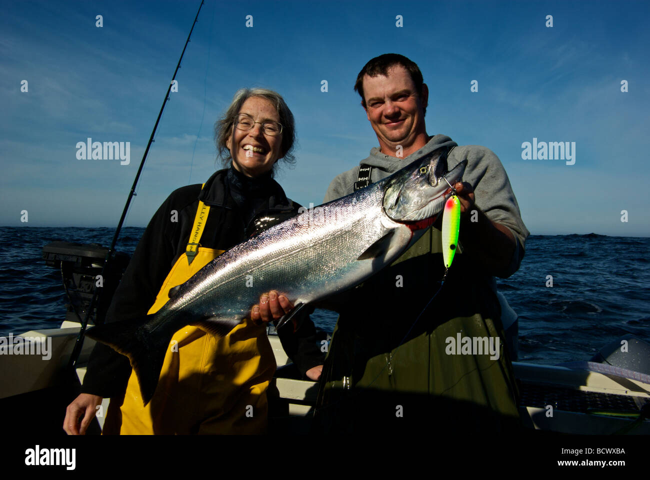 Happy female angler with her guide holding freshly caught Pacific ...