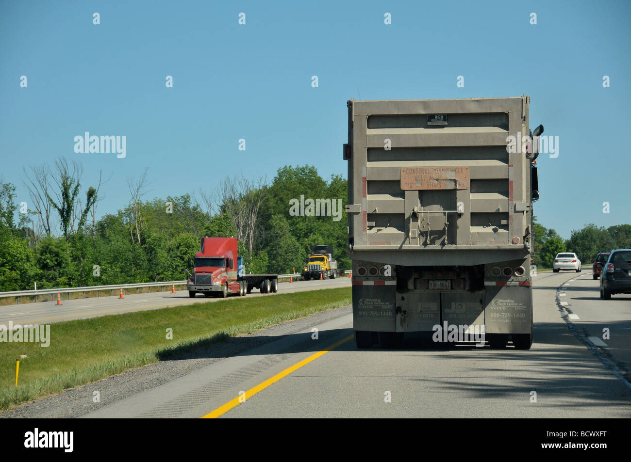 Interstate traffic with trucks Stock Photo - Alamy