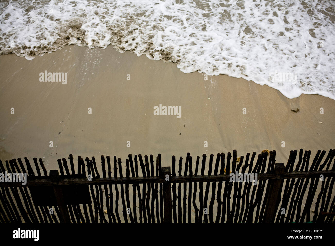 The waves crash into the shore on the island of Palawan in the ...