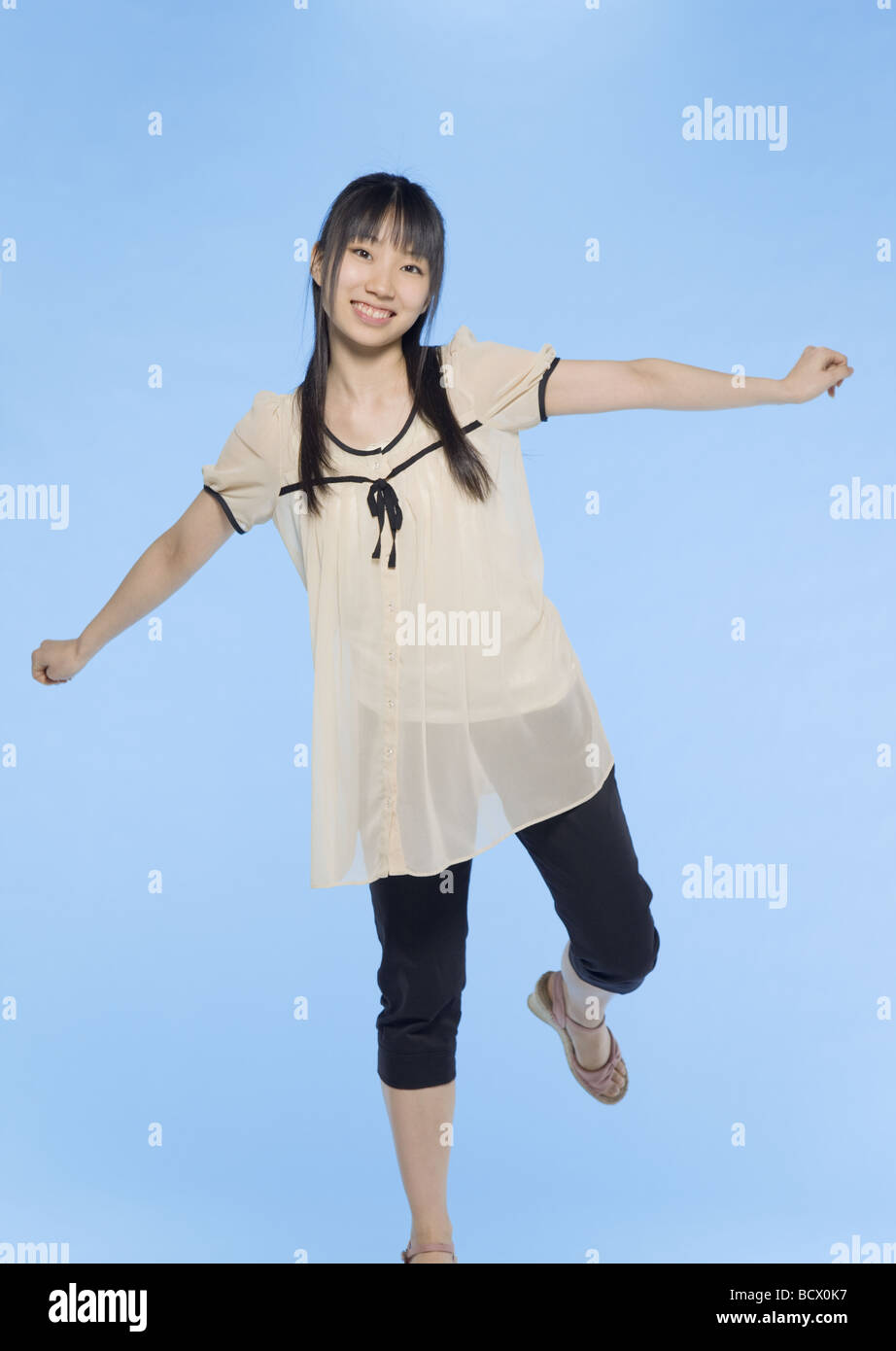 Young woman skipping Stock Photo - Alamy