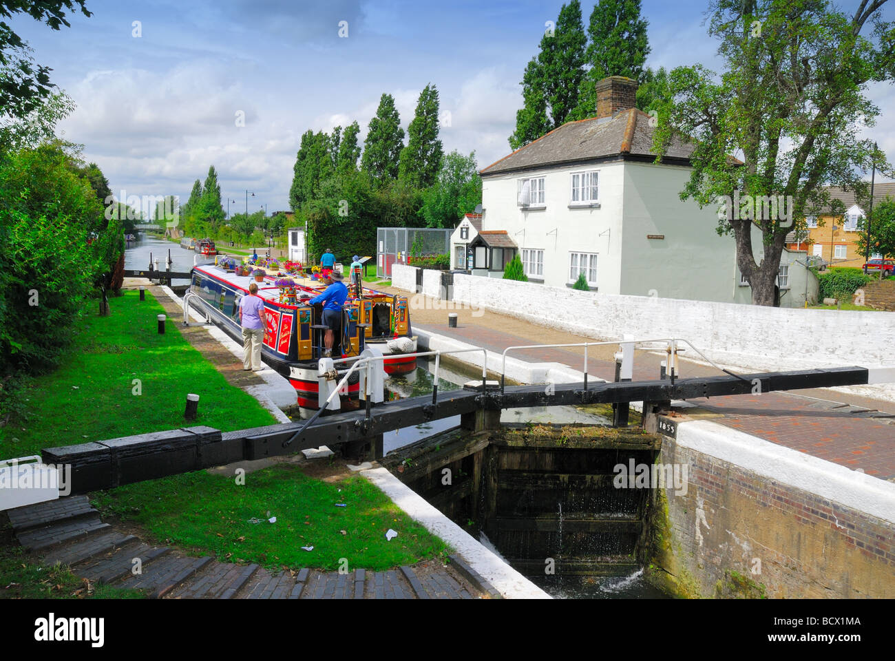 Canal boats passing through Hanwell lock on the grand union canal west ...