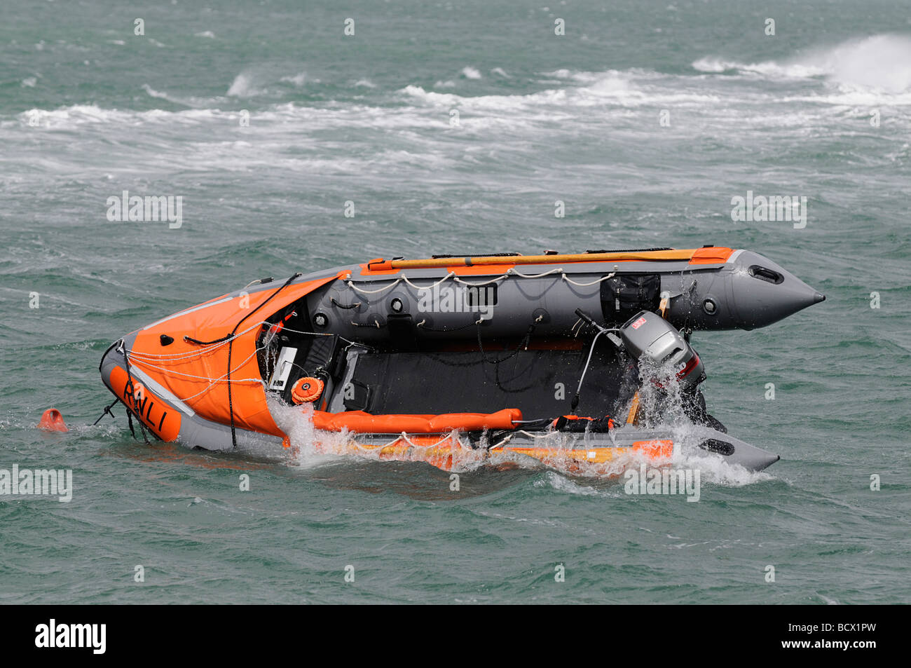 Righting a capsized boat Stock Photo - Alamy