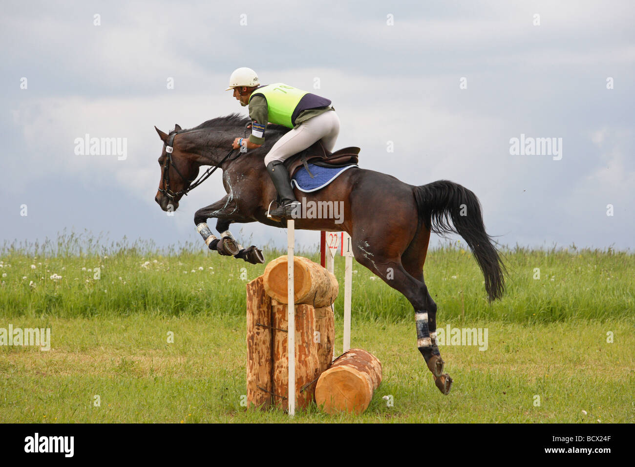 Event rider competing in cross country phase of competition Stock Photo ...