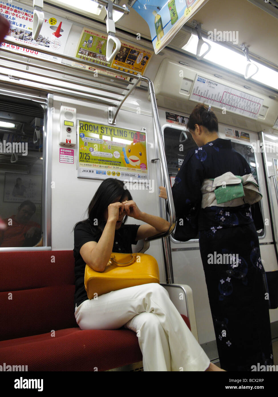 Woman in tokyo subway hi-res stock photography and images - Alamy