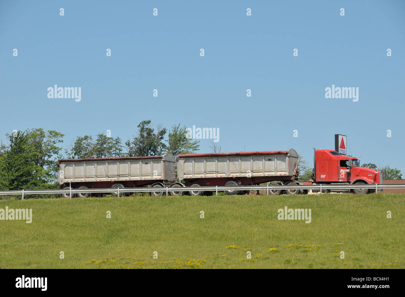 Interstate traffic with trucks Stock Photo - Alamy