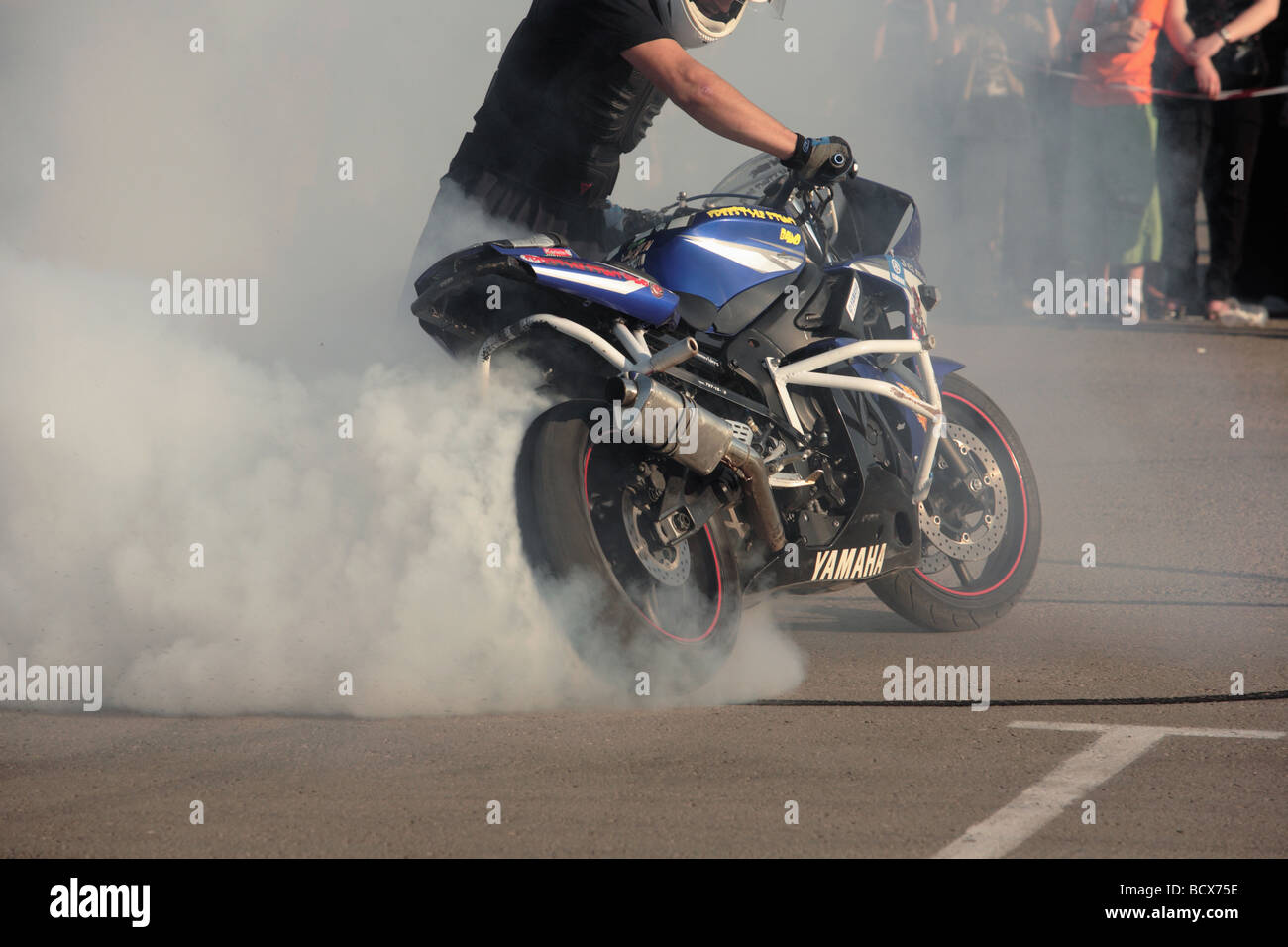 A biker performing a burnout Stock Photo - Alamy