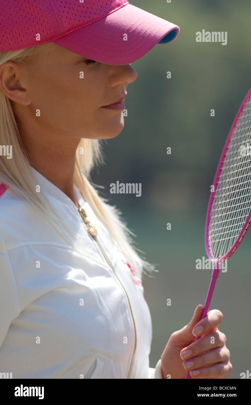 young woman holding racket Stock Photo - Alamy