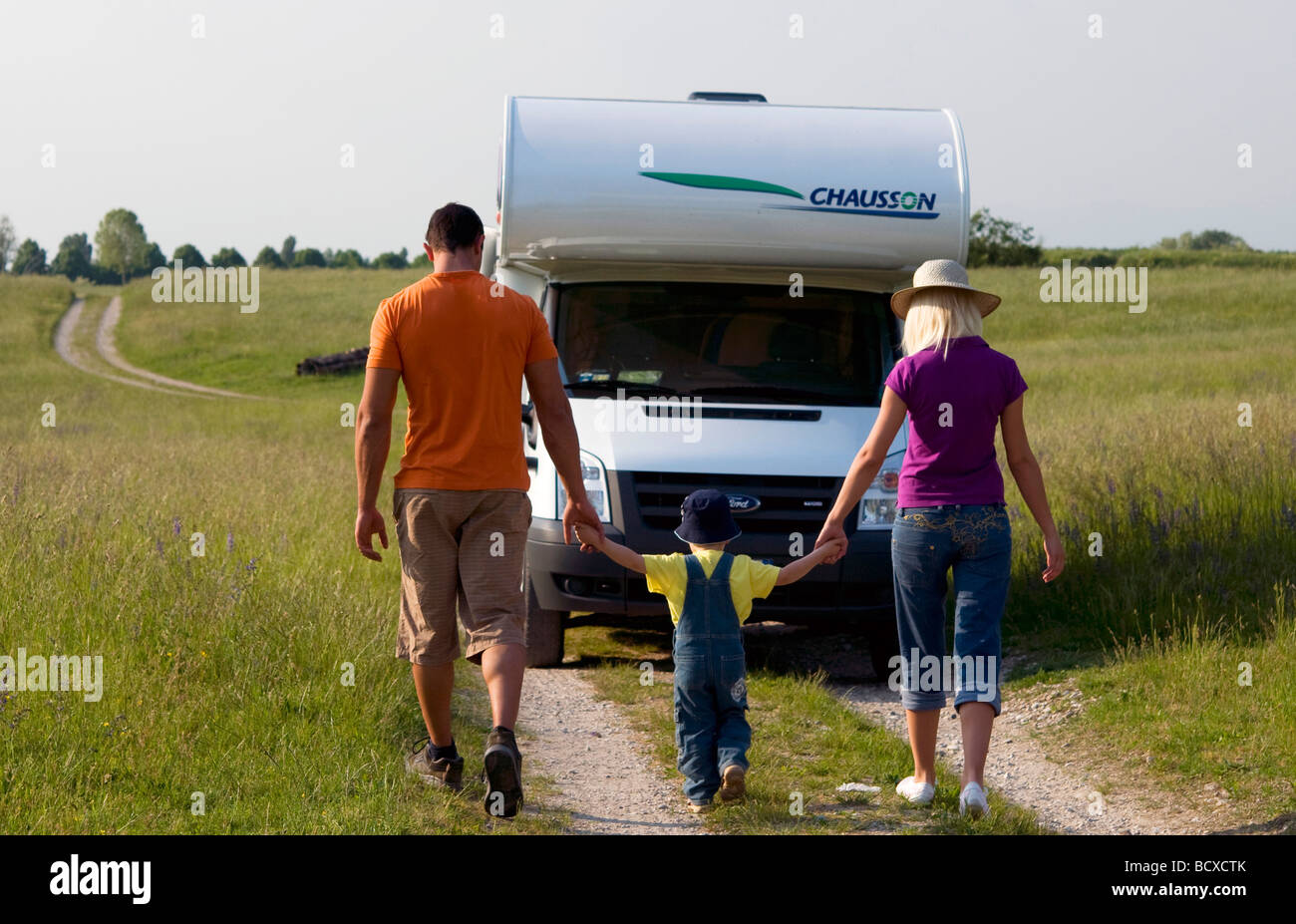 family with camper in countryside Stock Photo - Alamy