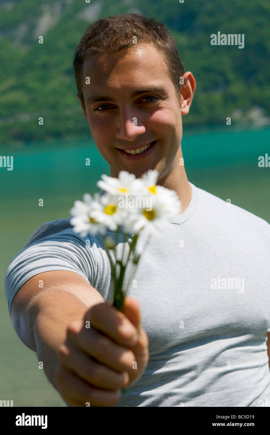 man holding daisy Stock Photo - Alamy