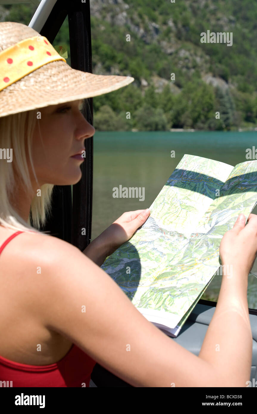 young woman holding a map Stock Photo - Alamy