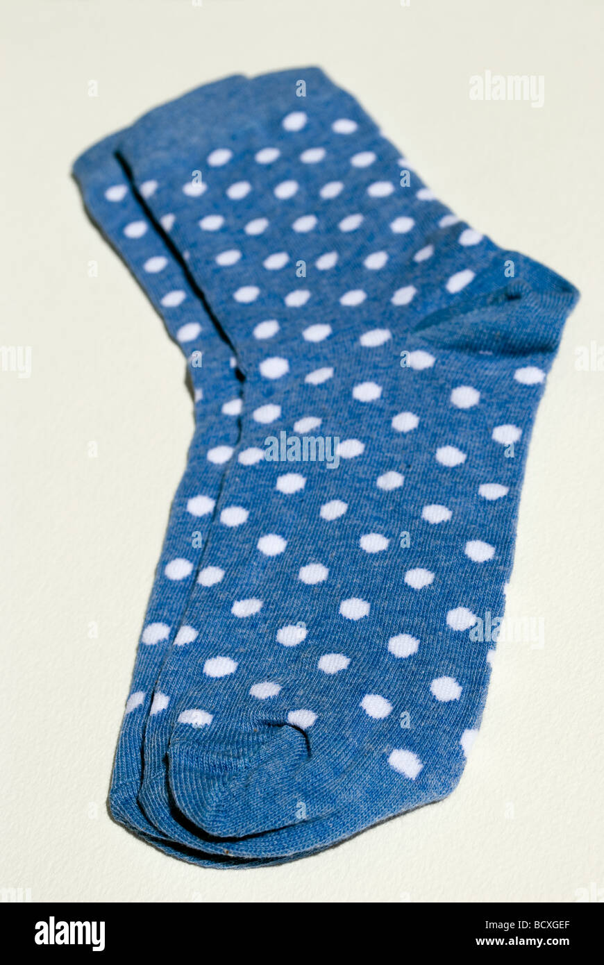 A pair of blue and white polka-dot socks Stock Photo - Alamy
