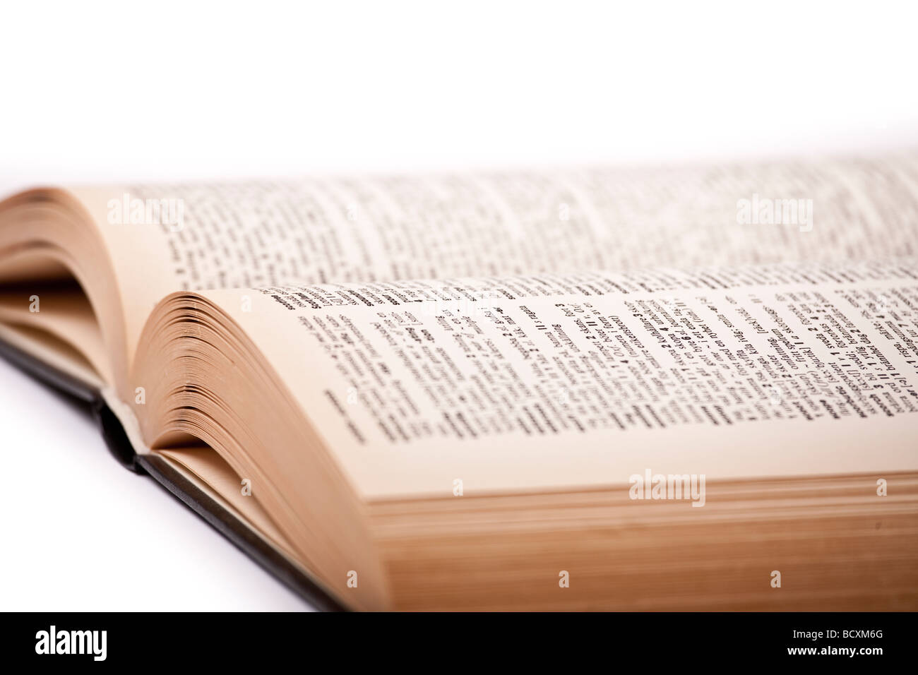 Close up of an open old dictionary shallow focus Stock Photo - Alamy