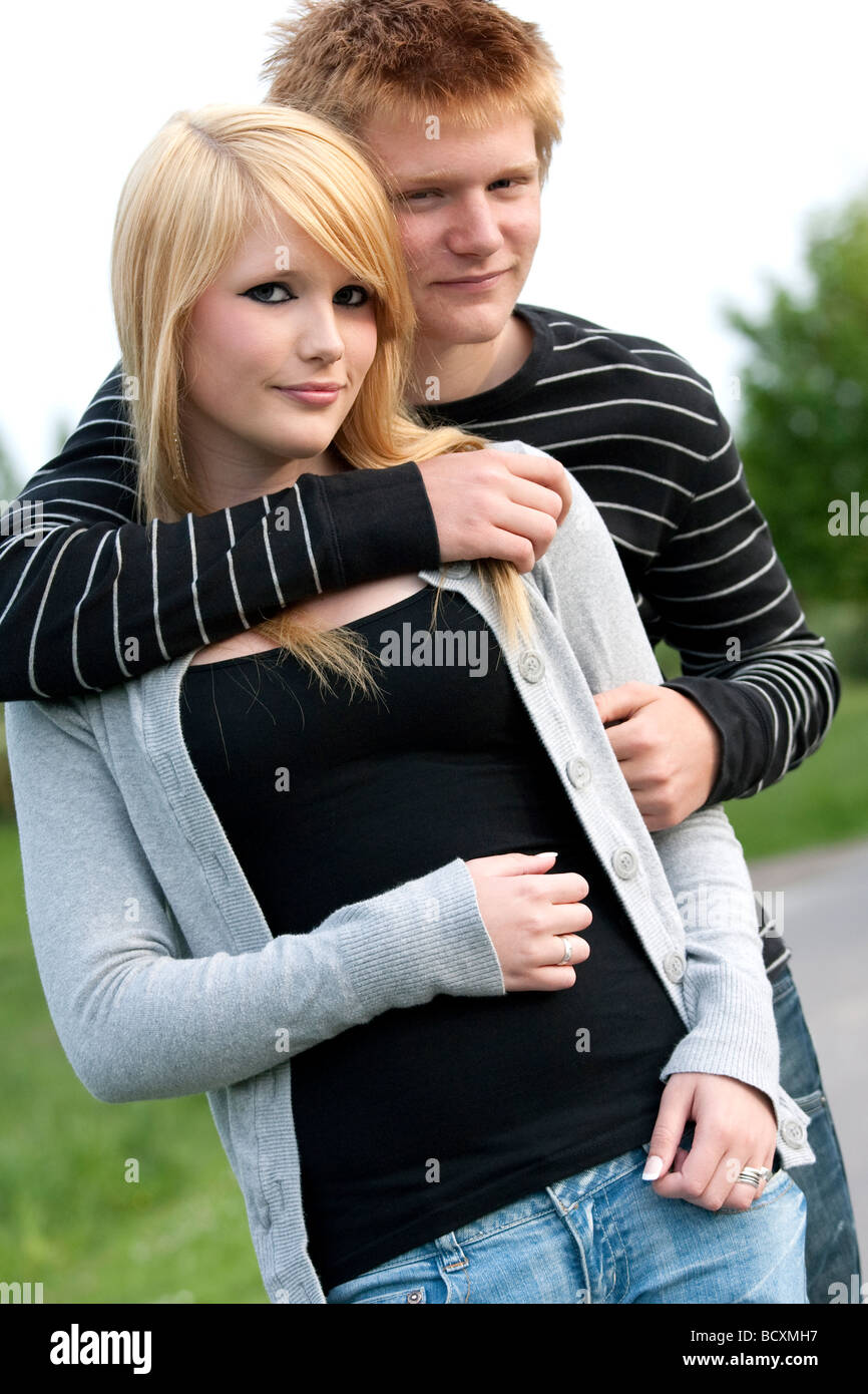 Teen couple together, hugging Stock Photo - Alamy