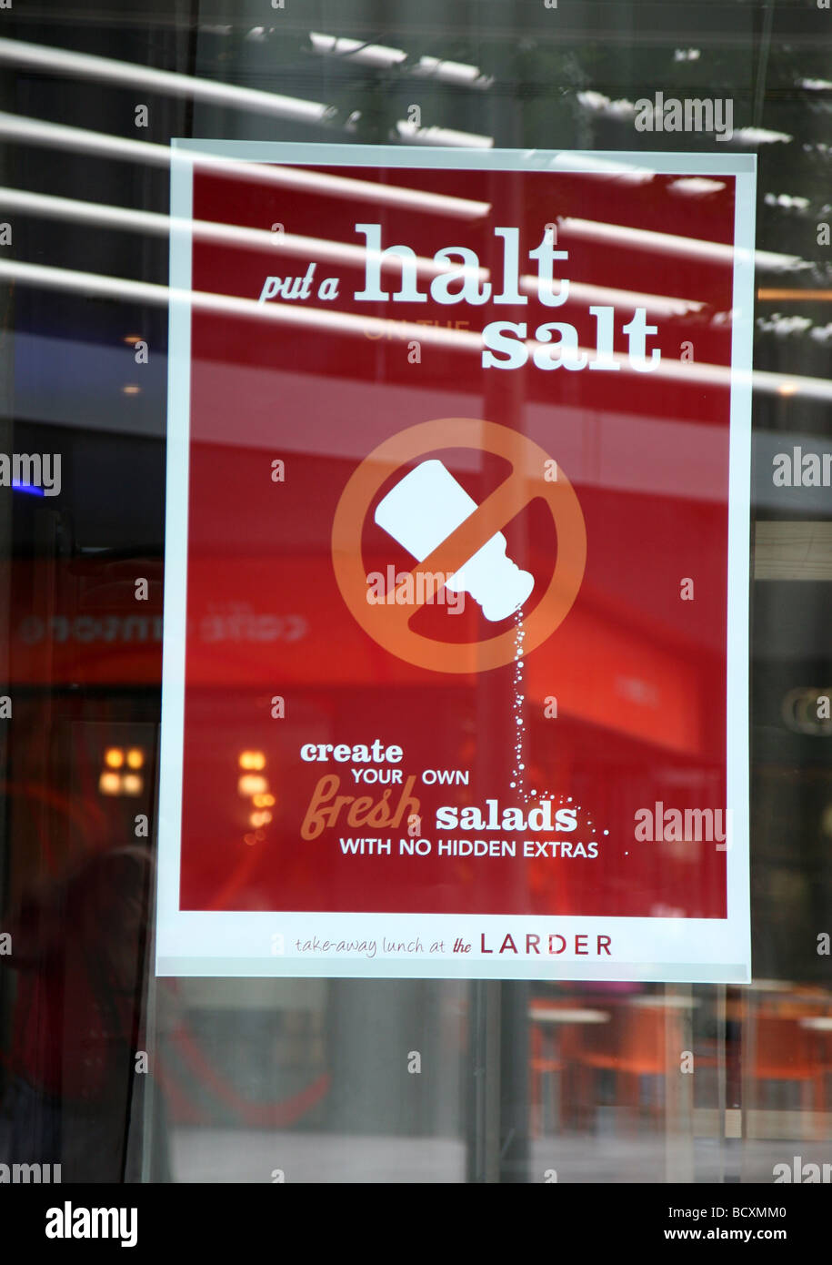 Reduced salt poster in restaurant window, London Stock Photo - Alamy