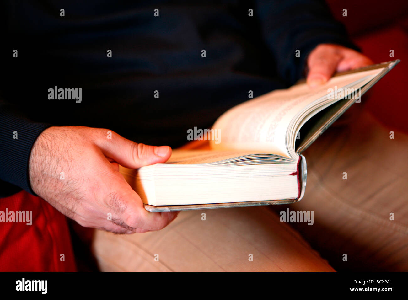 man reading a book Stock Photo - Alamy