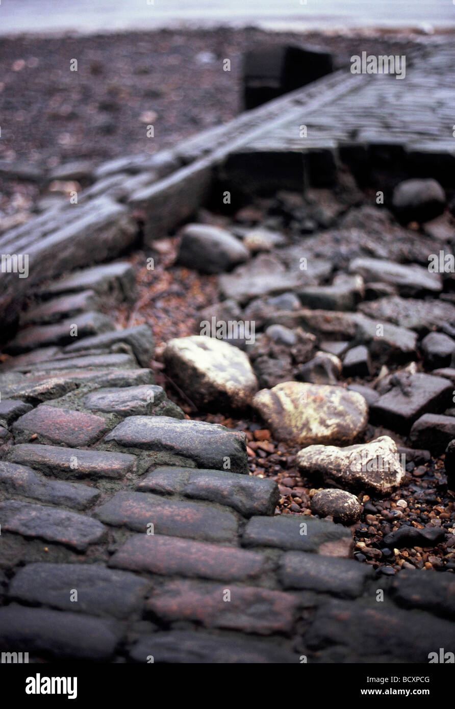 A broken walkway on the bank of the River Thames, London, England Stock ...