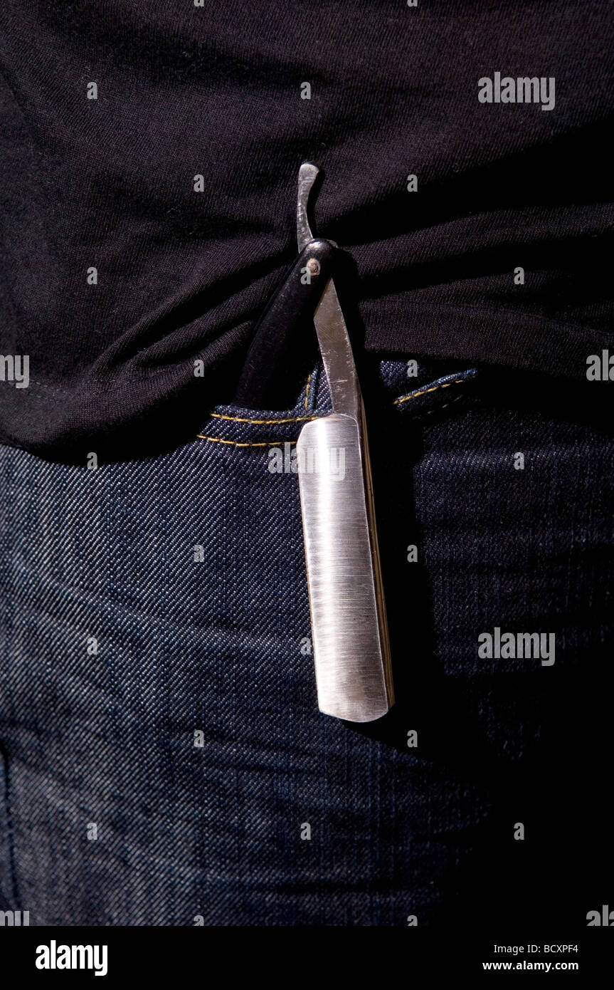 Man carrying a razor blade in his pocket Stock Photo - Alamy
