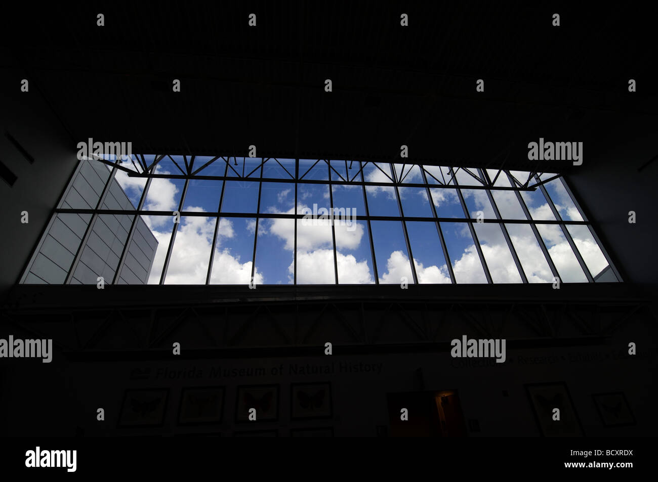 large windows looking out into blue sky and white clouds Stock Photo ...
