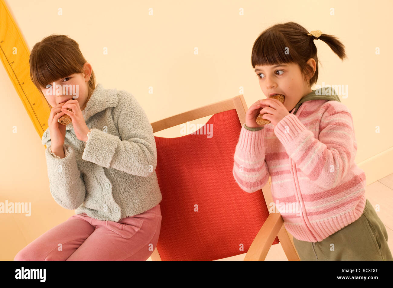 little girls eating snacks Stock Photo - Alamy