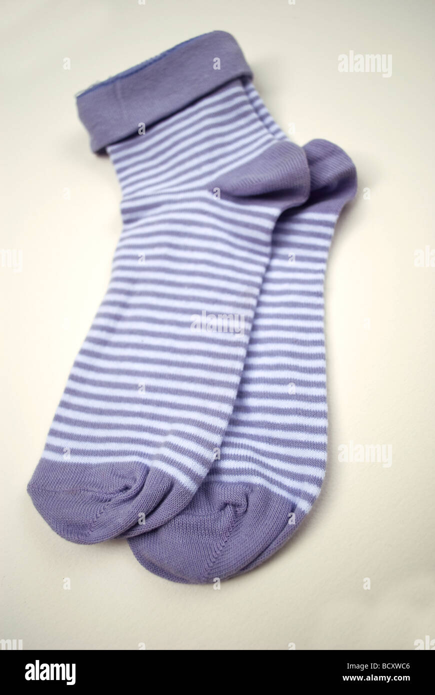 A pair of purple and white striped socks Stock Photo - Alamy