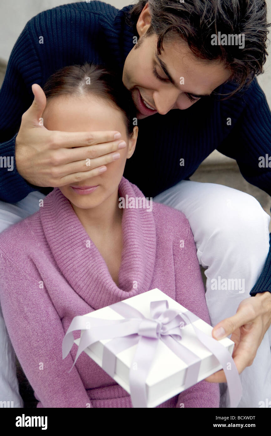 man giving gift to woman Stock Photo - Alamy