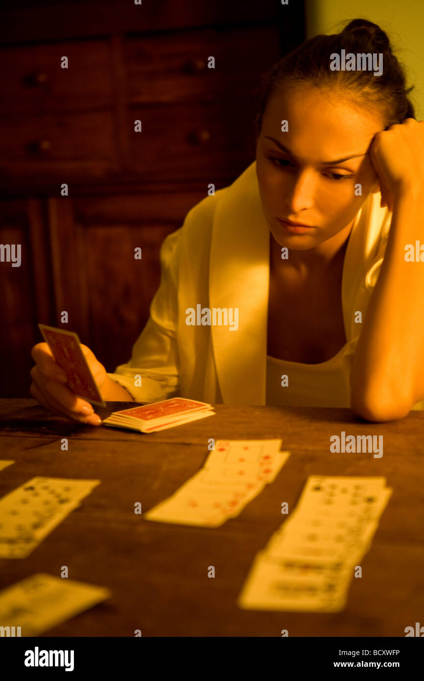 woman playing a game of patience Stock Photo - Alamy