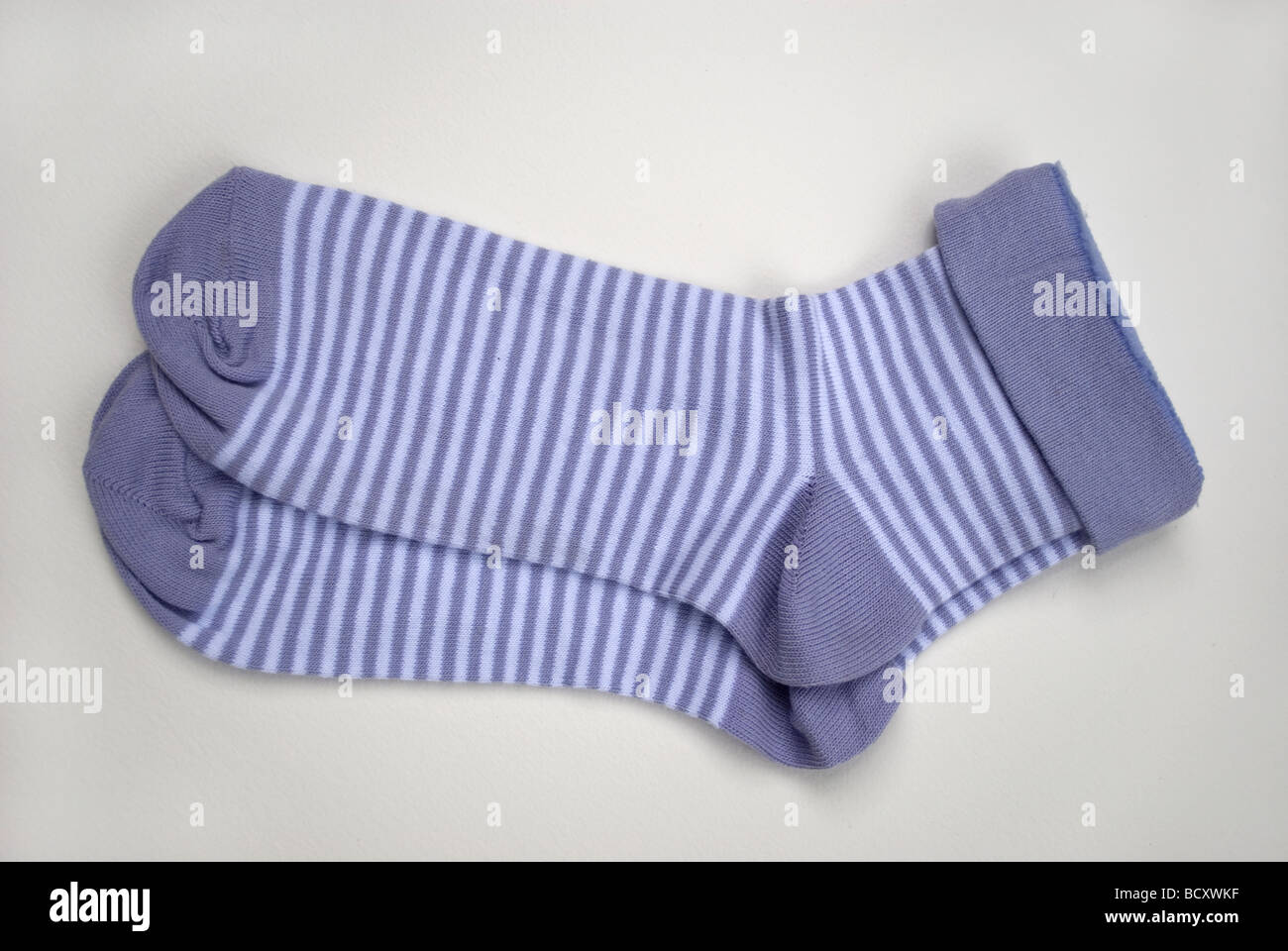 A pair of purple and white striped socks Stock Photo - Alamy