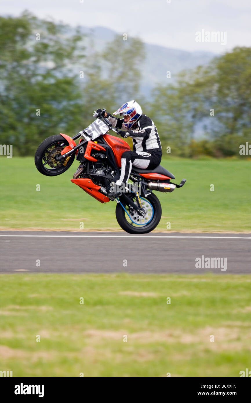 Kevin Carmichael Extreme Stunt ride on motorcycle pulling wheelie Stock ...