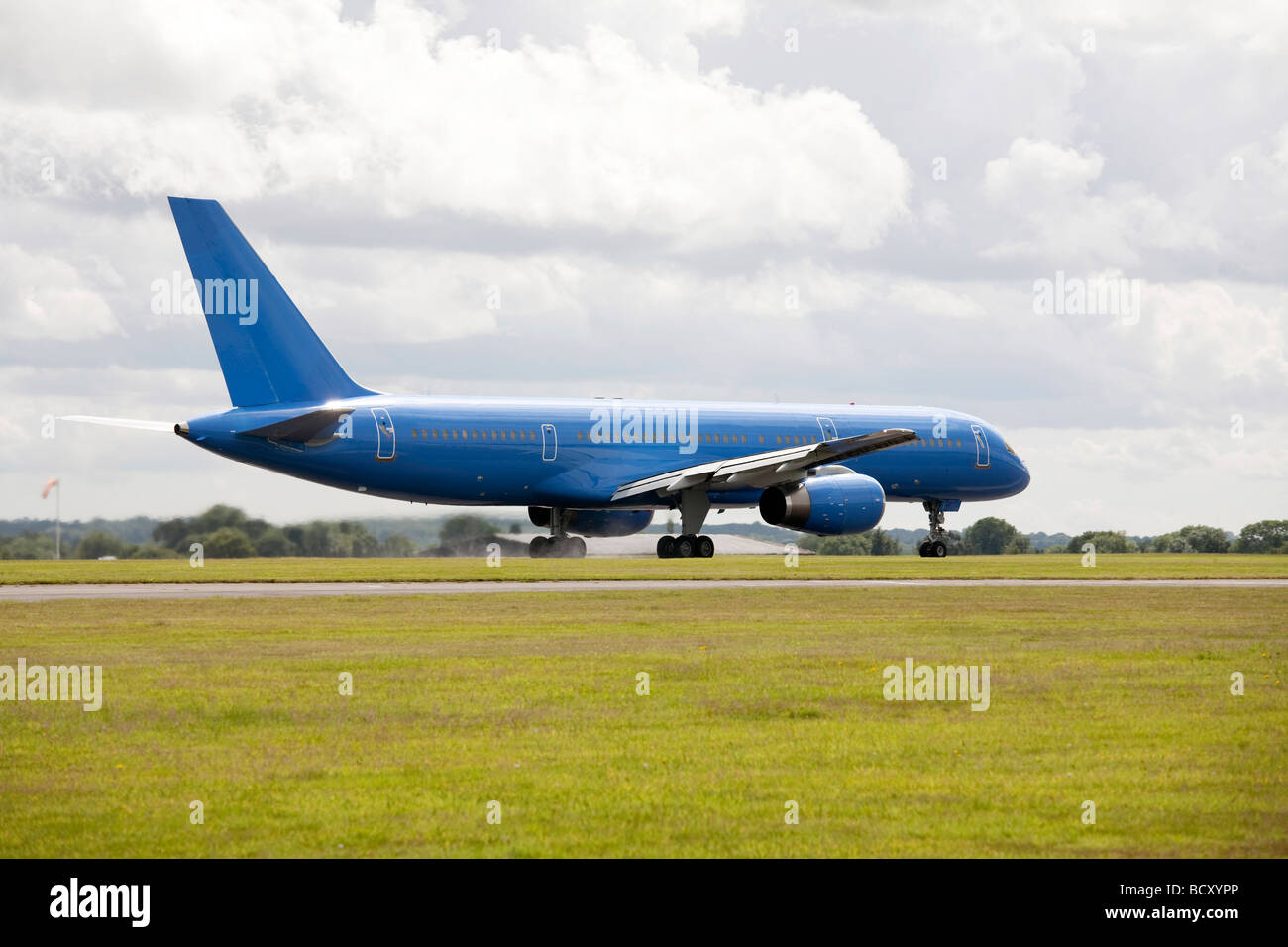 large blue passenger jet aircraft on runway for take off Stock Photo ...